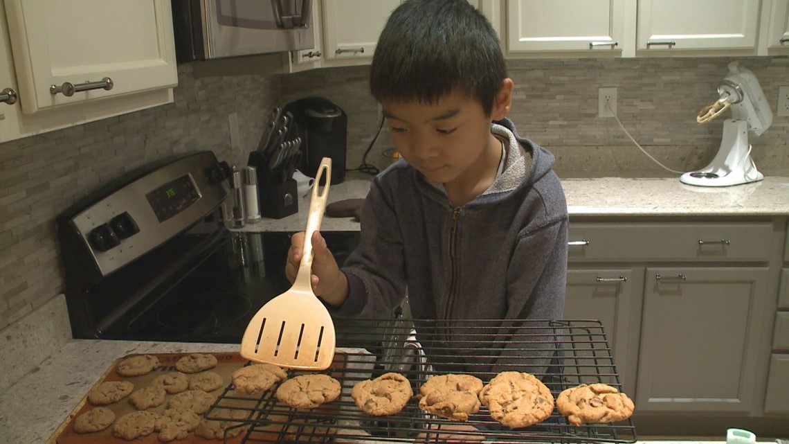 Boy bakes cookies to raise money to adopt a brother | wcnc.com