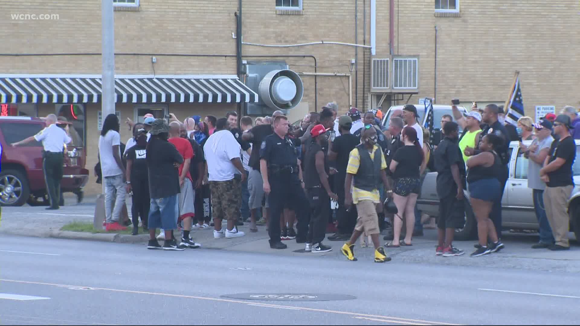 Protesters clash after alleged discrimination at ice cream shop | wcnc.com