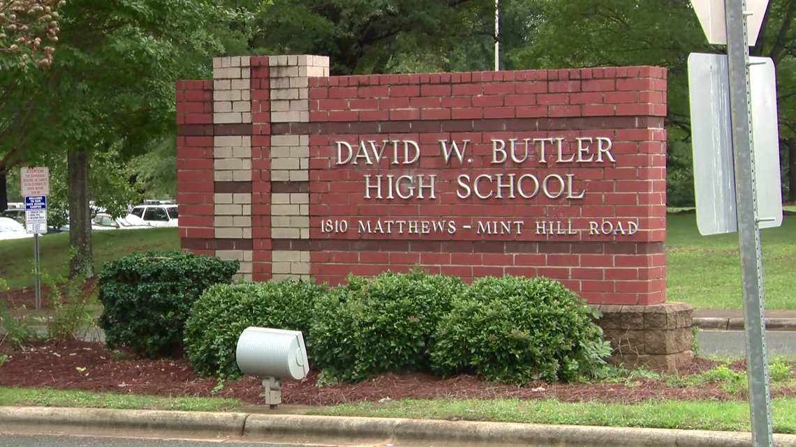 Butler High School employee charged with bringing guns to school ...