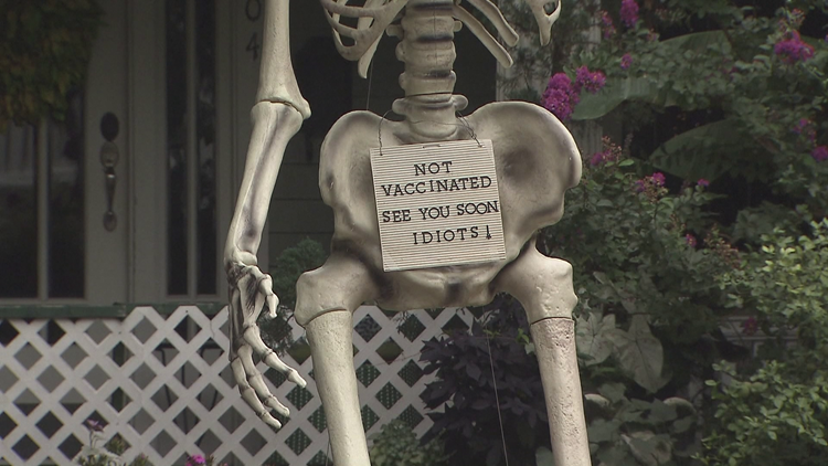 'See you soon, idiots': Man puts skeleton in yard pushing vaccine ...