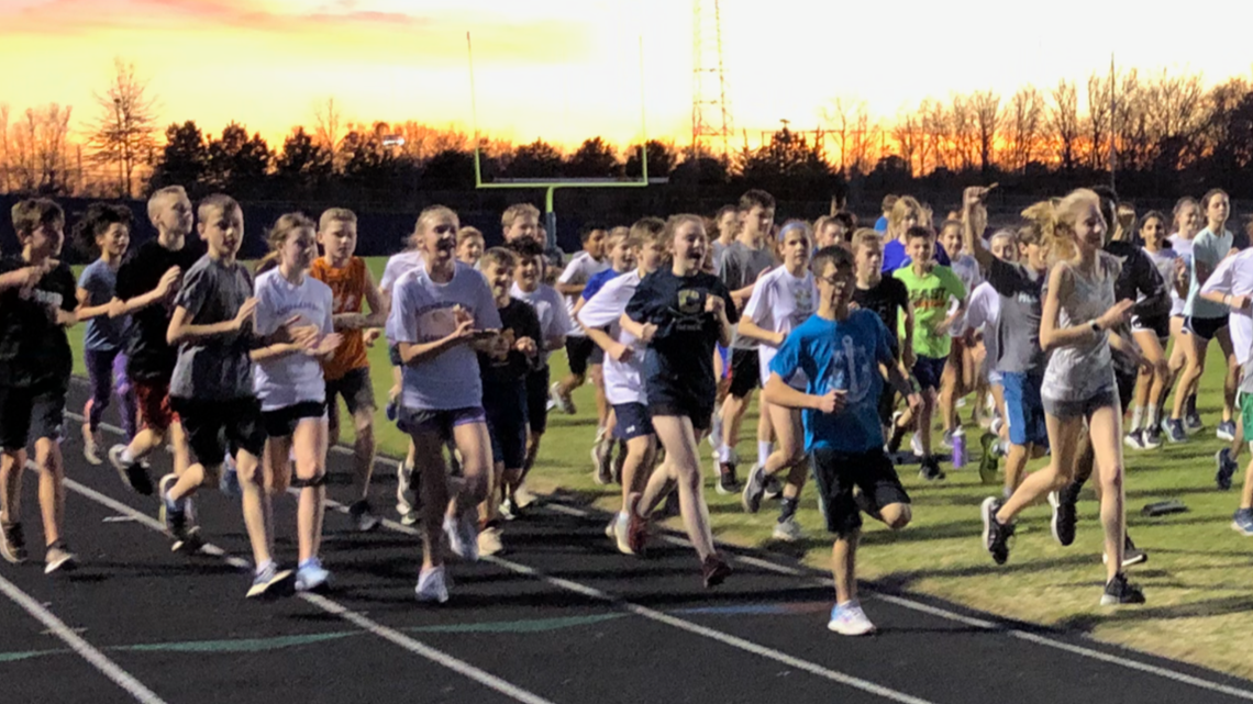 Kids help boy with Down syndrome cross finish line | wcnc.com