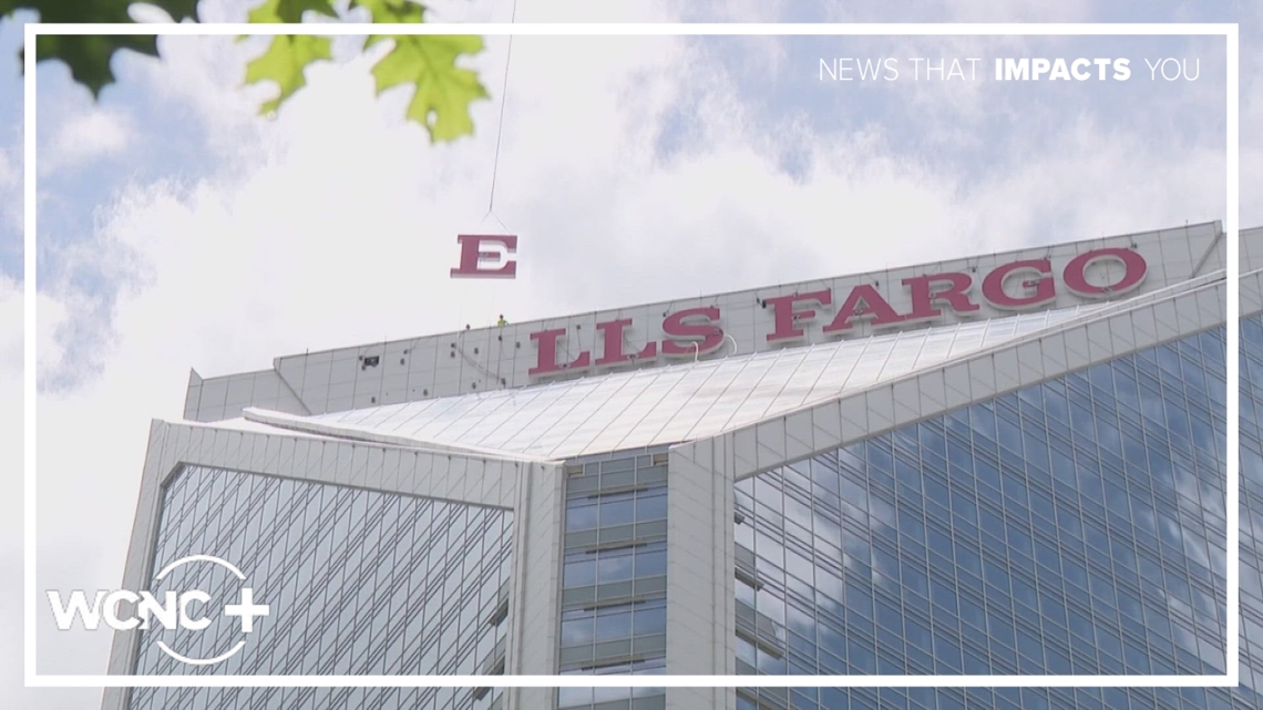 Crews install Wells Fargo sign in Uptown Charlotte | wcnc.com