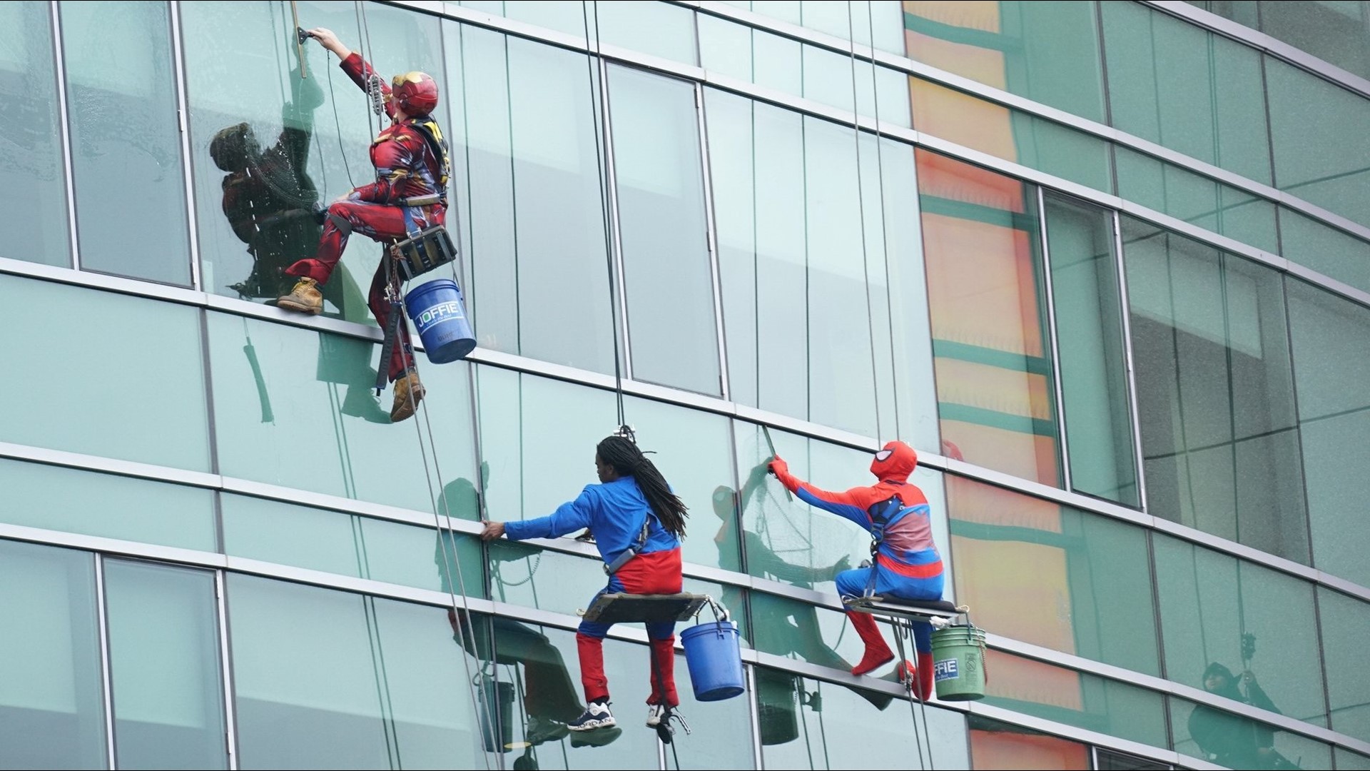 Window washers dress as superheros to surprise patients at Levine ...