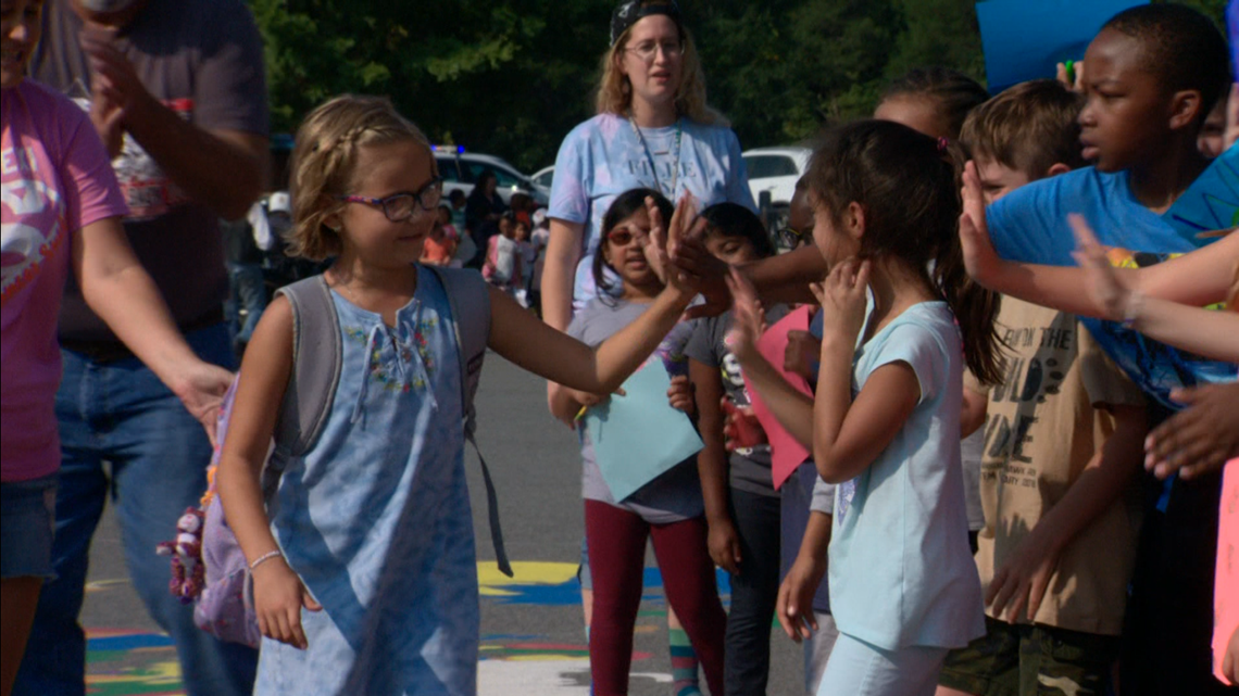 'Go Lexi!' | Police escort 8-year-old cancer survivor back to school ...