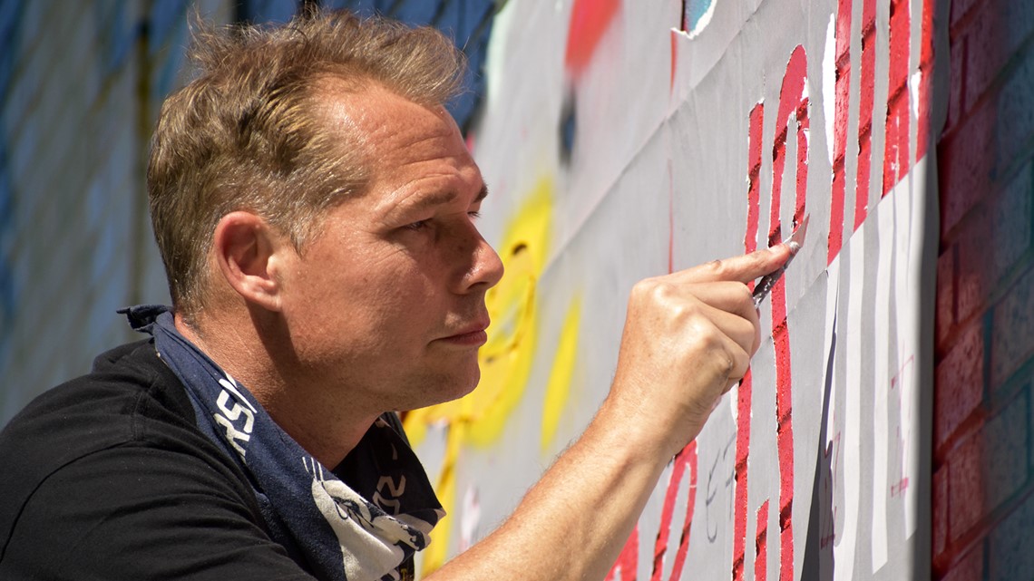 Shepard Fairley to finish mural at Queens University this week | wcnc.com