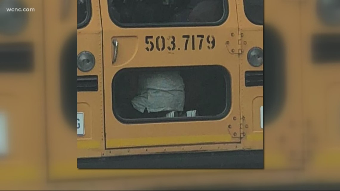 Viral picture shows student kneeling in aisle of school bus | wcnc.com