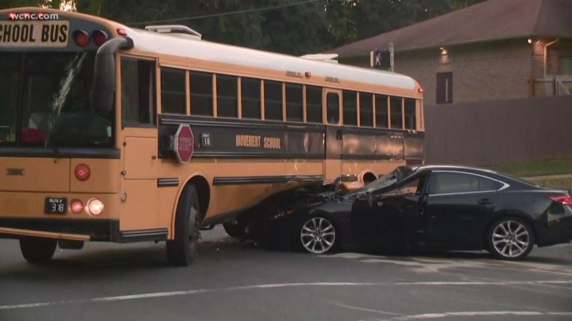 Car pinned under school bus in west Charlotte | wcnc.com