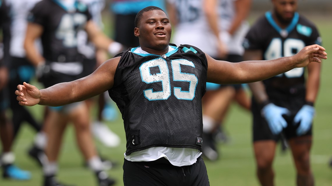 Charlotte foster kids receive gifts from Panthers' Derrick Brown | wcnc.com