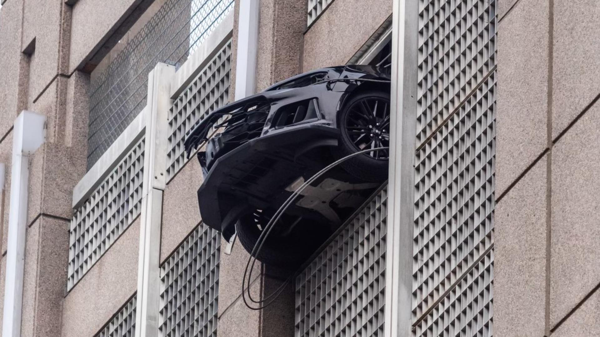 Car hangs off edge of Uptown parking deck | wcnc.com