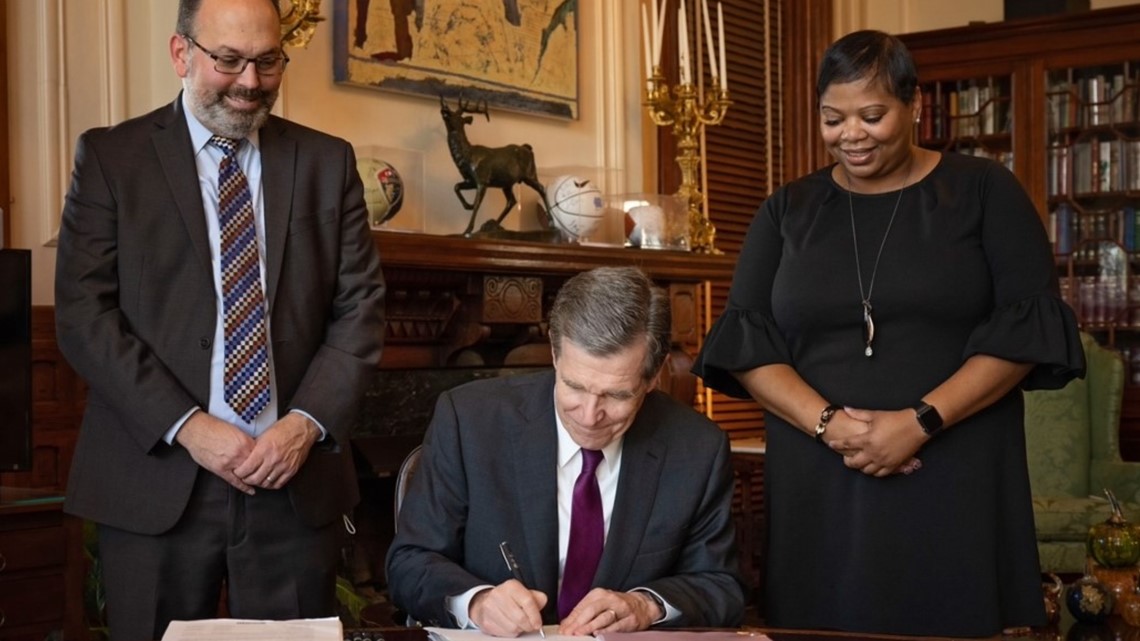 Gov. Cooper signs overdue budget hours after lawmakers approve it ...