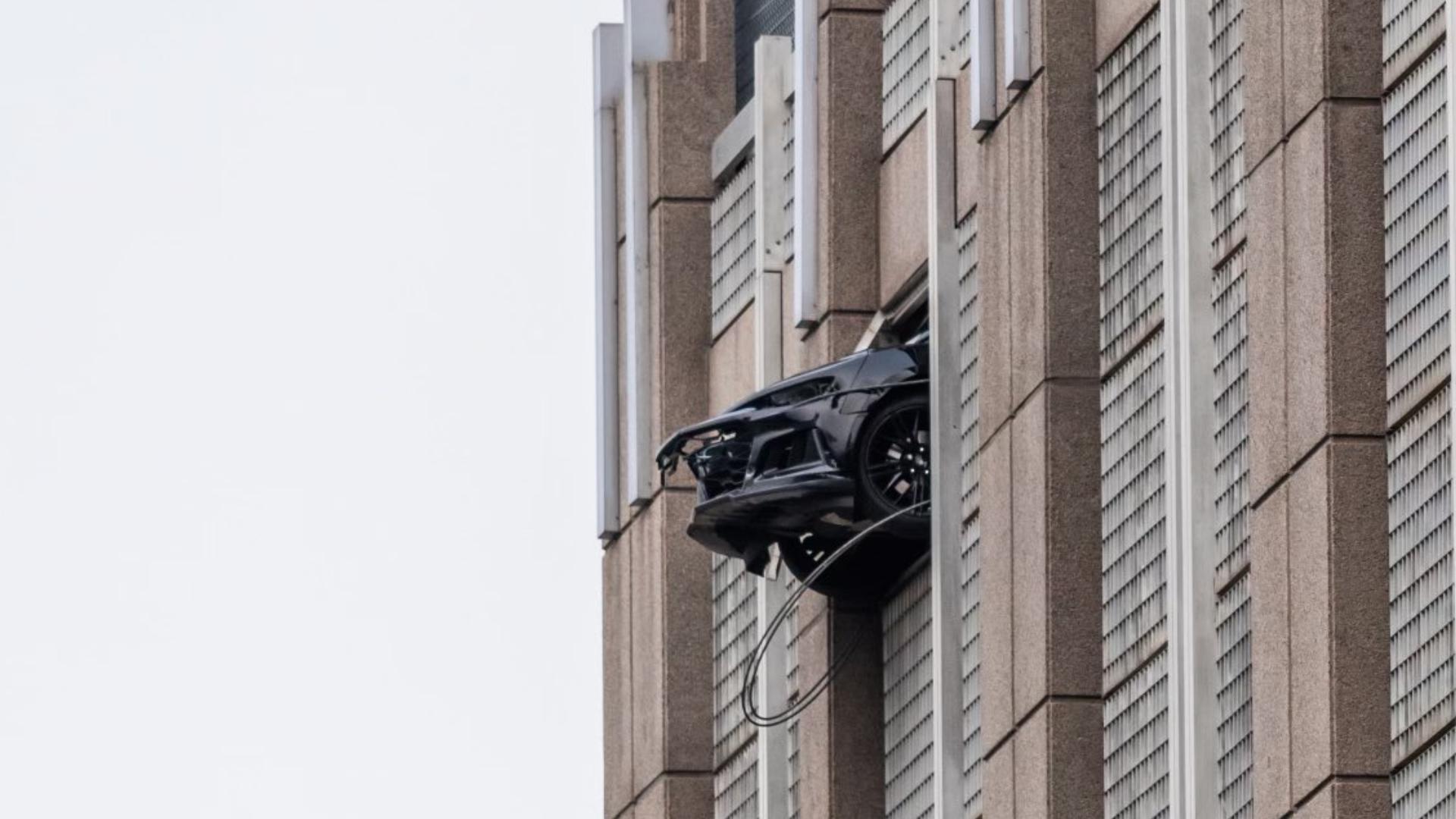 Car hangs off edge of Uptown parking deck | wcnc.com