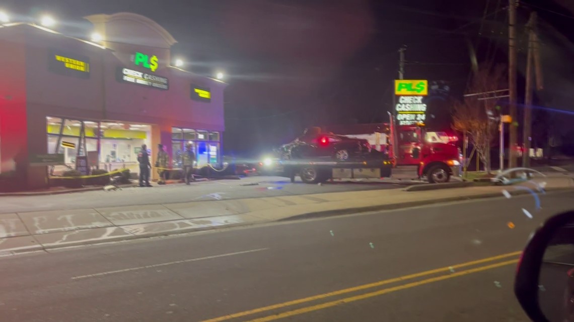 Car crashes into building at busy Charlotte intersection | wcnc.com